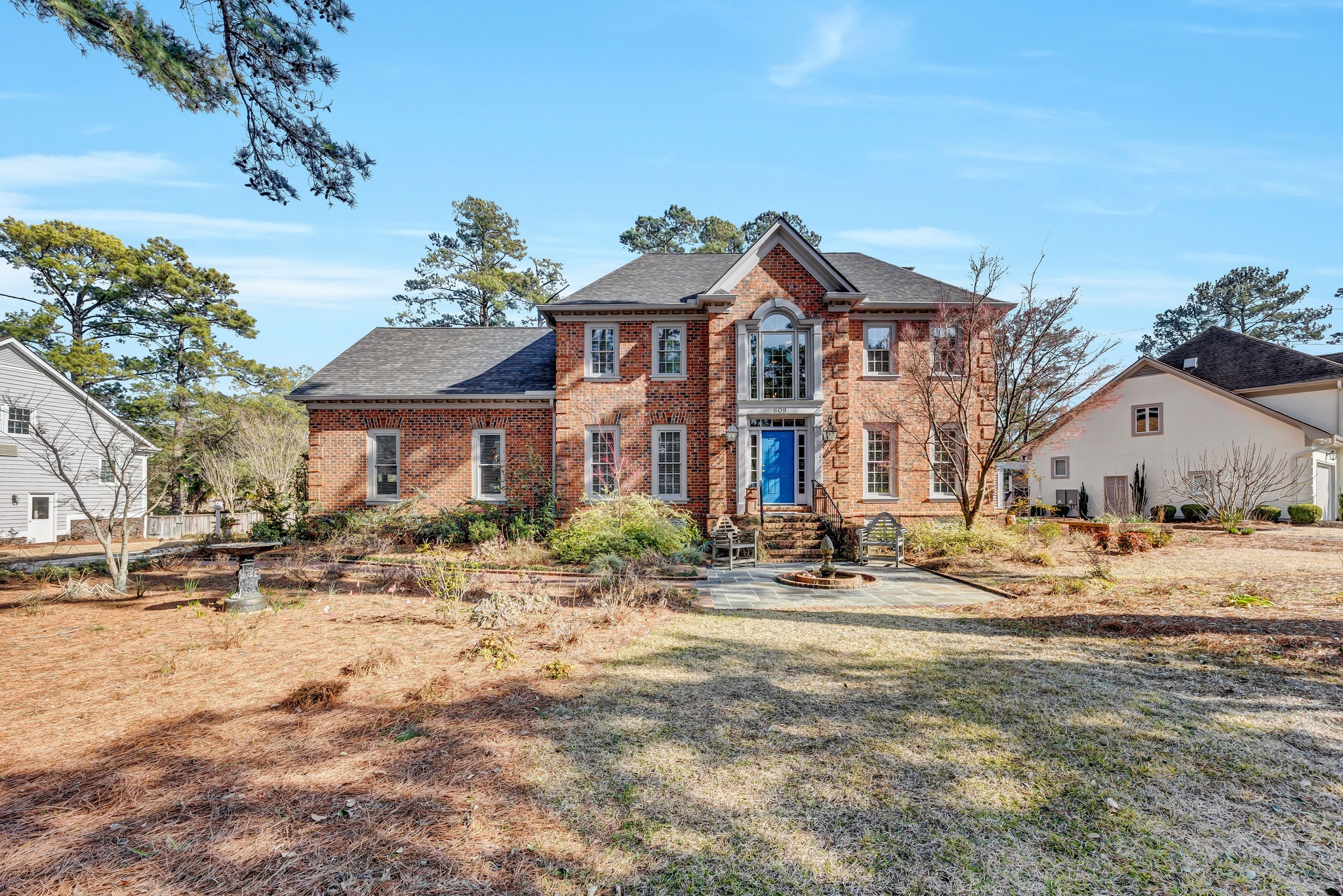 Set on more than an acre overlooking Hewletts Creek, this brick ...